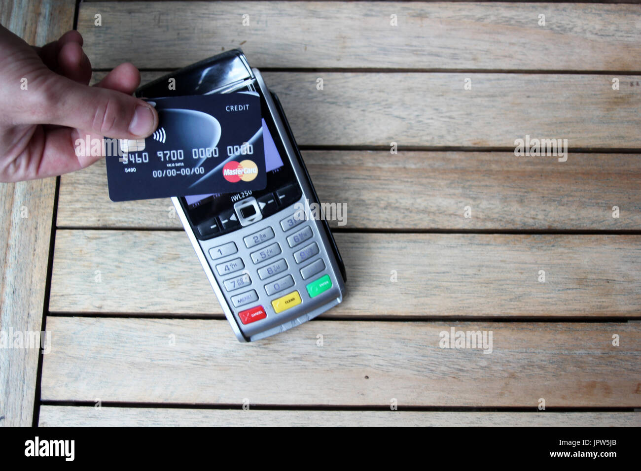 contactless payment card pdq background copy space with hand holding ...