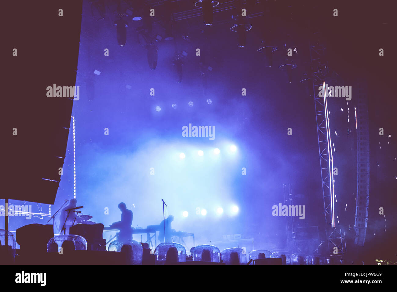 Band performing a live concert on the stage Stock Photo - Alamy