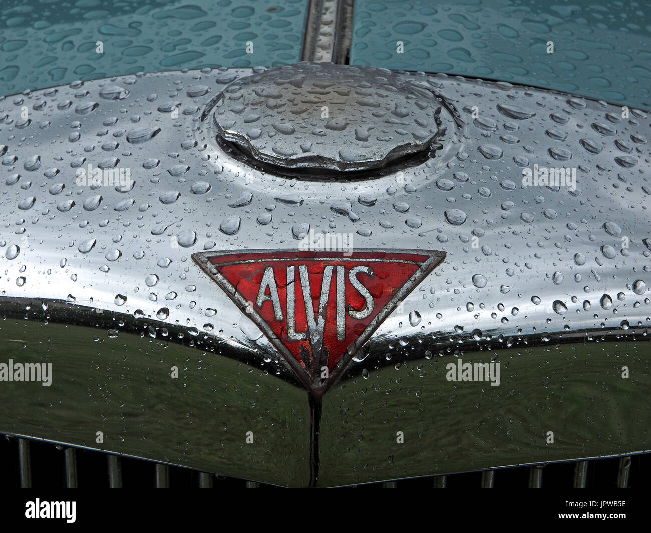 raindrops on pristine duck egg blue paintwork of classic car with ...
