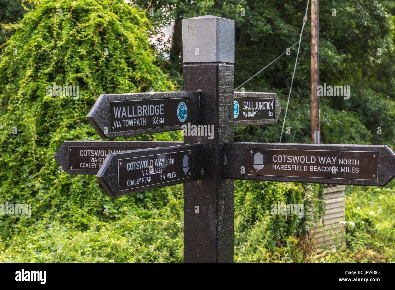 Signpost on the Cotswold Way as it passes over the Stroudwater Canal ...