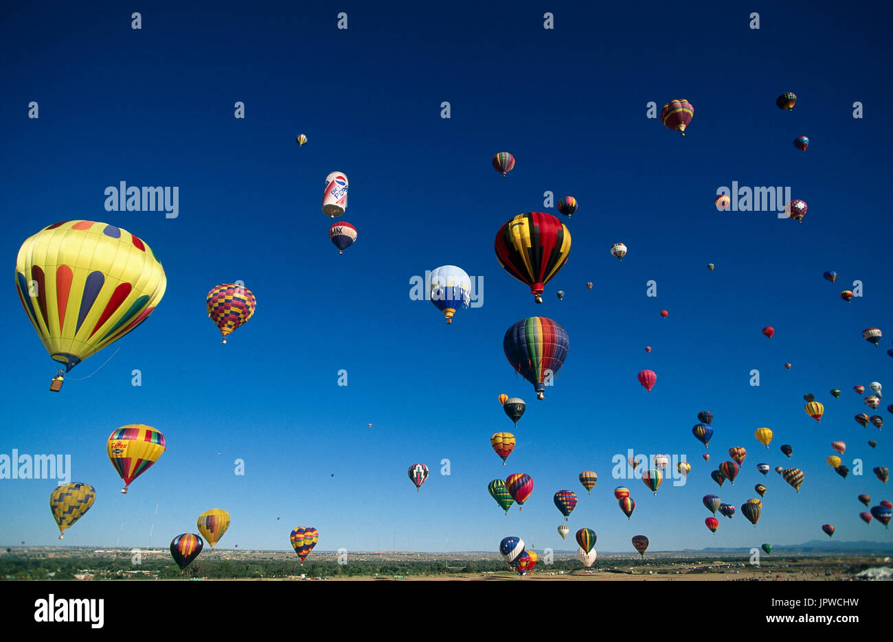 multi-coloured hot air balloons mass-ascent Stock Photo - Alamy