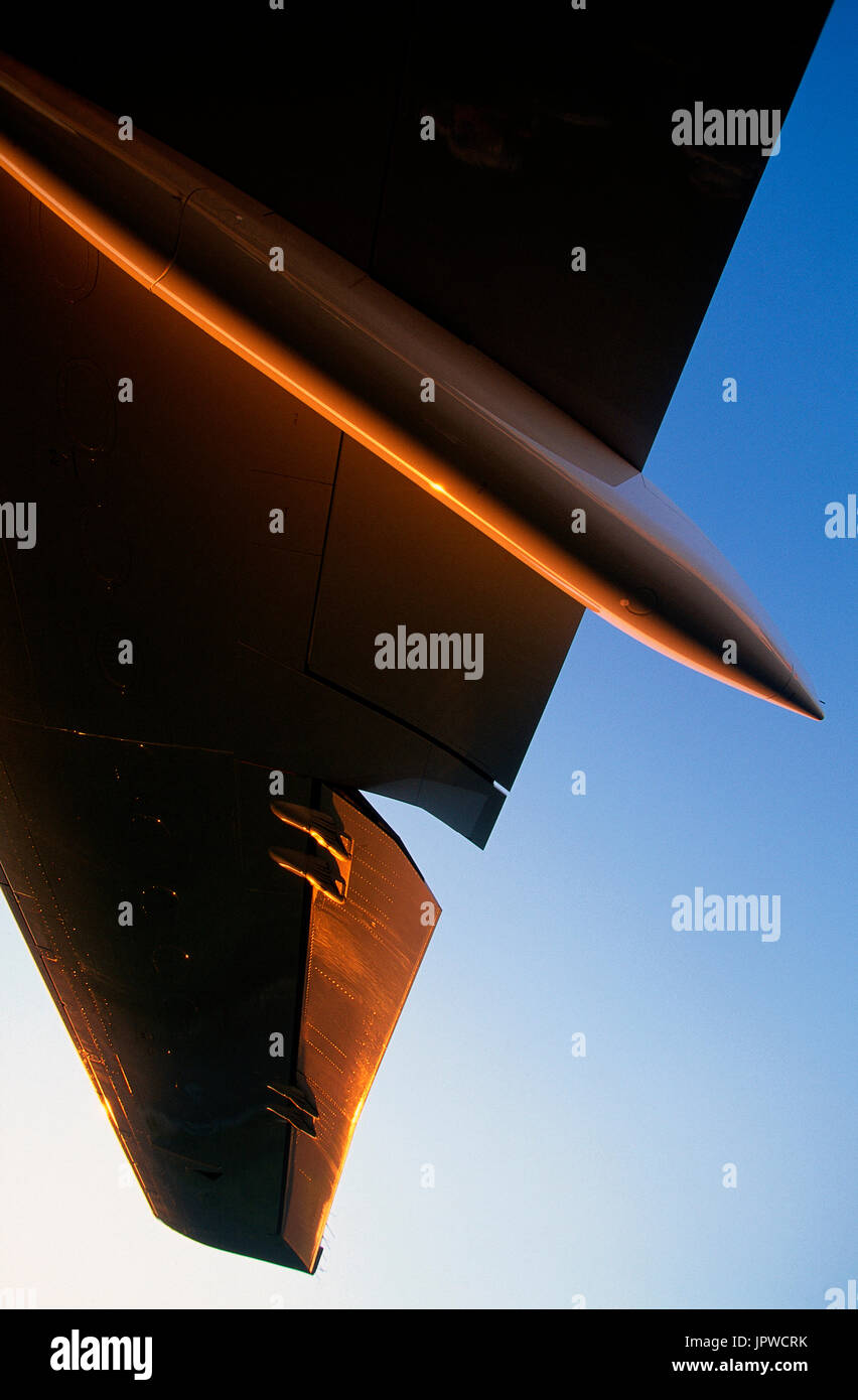 wing with aileron deflected down and boat-fairing on a Gulf Air Airbus ...