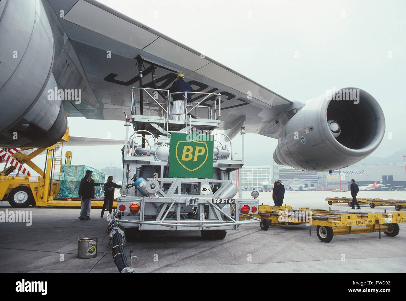 BP refuelling bowser under wing and a GE CF-6-50E2 engine intake of a ...