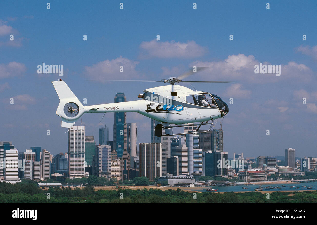 Eurocopter EC-120 Colibri prototype flying enroute with downtown ...