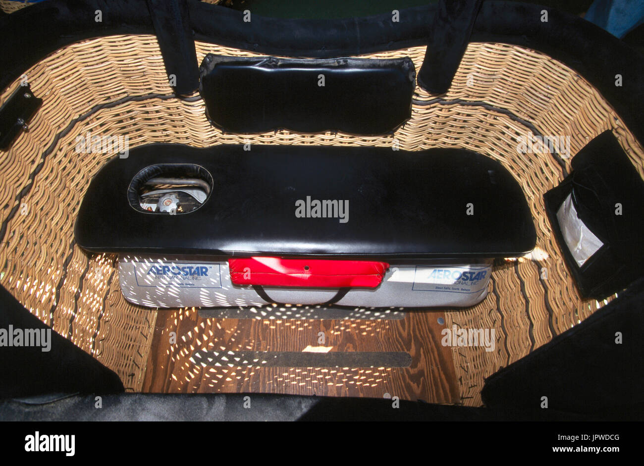 wicker basket of hotair-balloon showing gas fuel tank under bench seats ...