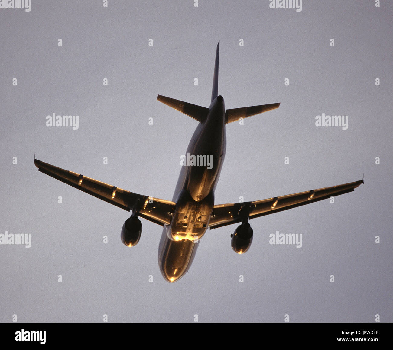 Airbus A320 flying enroute with golden light reflecting off of the ...