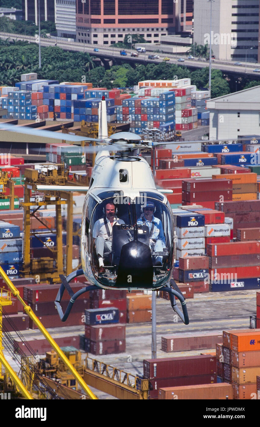 Eurocopter EC-120 Colibri prototype flying with container port behind ...