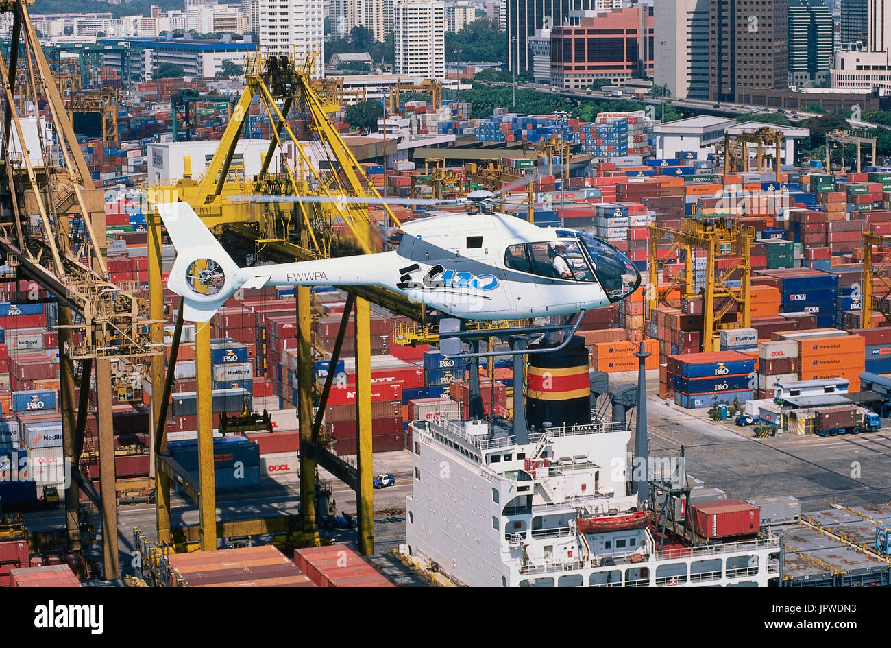 Eurocopter EC-120 Colibri prototype flying with container port and ...