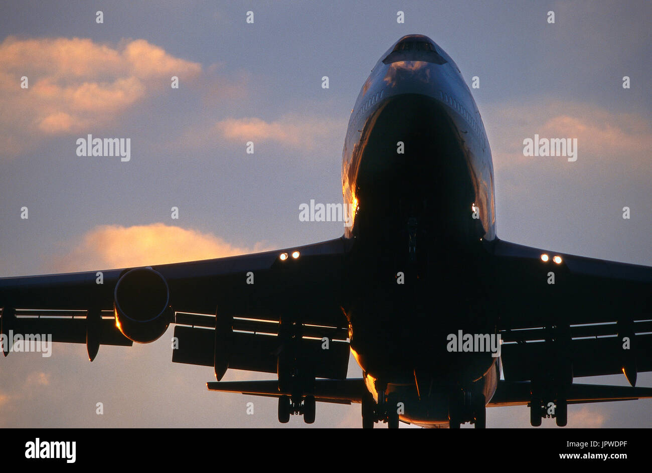 Boeing 747 on final-approach with flaps deployed at dusk Stock Photo ...