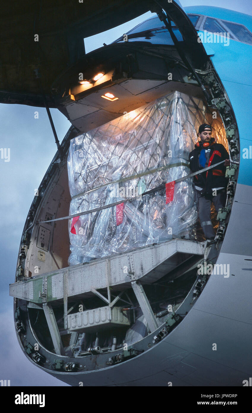 man at open nose cargo loading door of a Korean Air Lines Boeing 747 ...