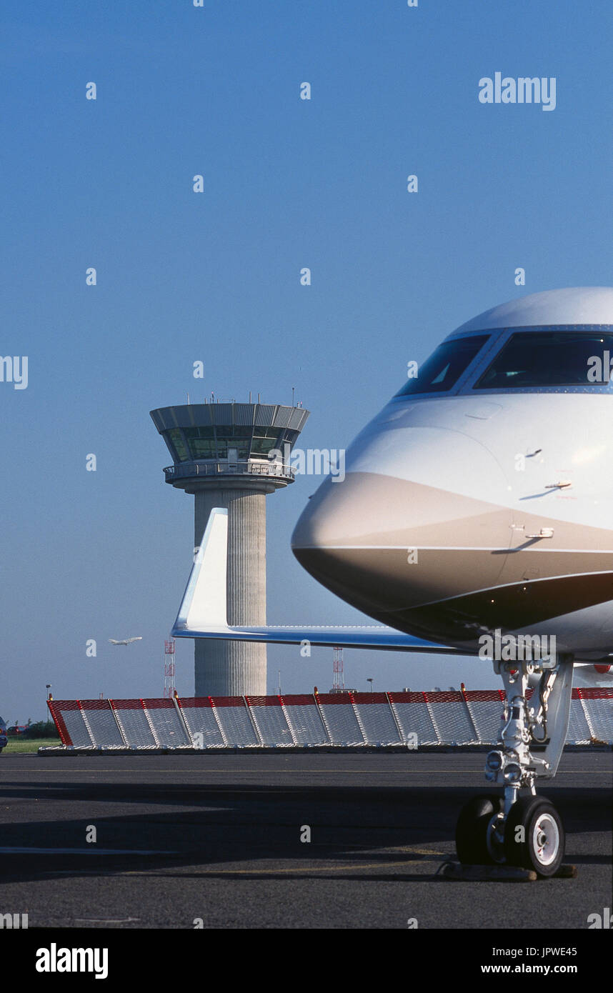 Gulfstream 500 with blast fence and air-traffic control-tower behind ...