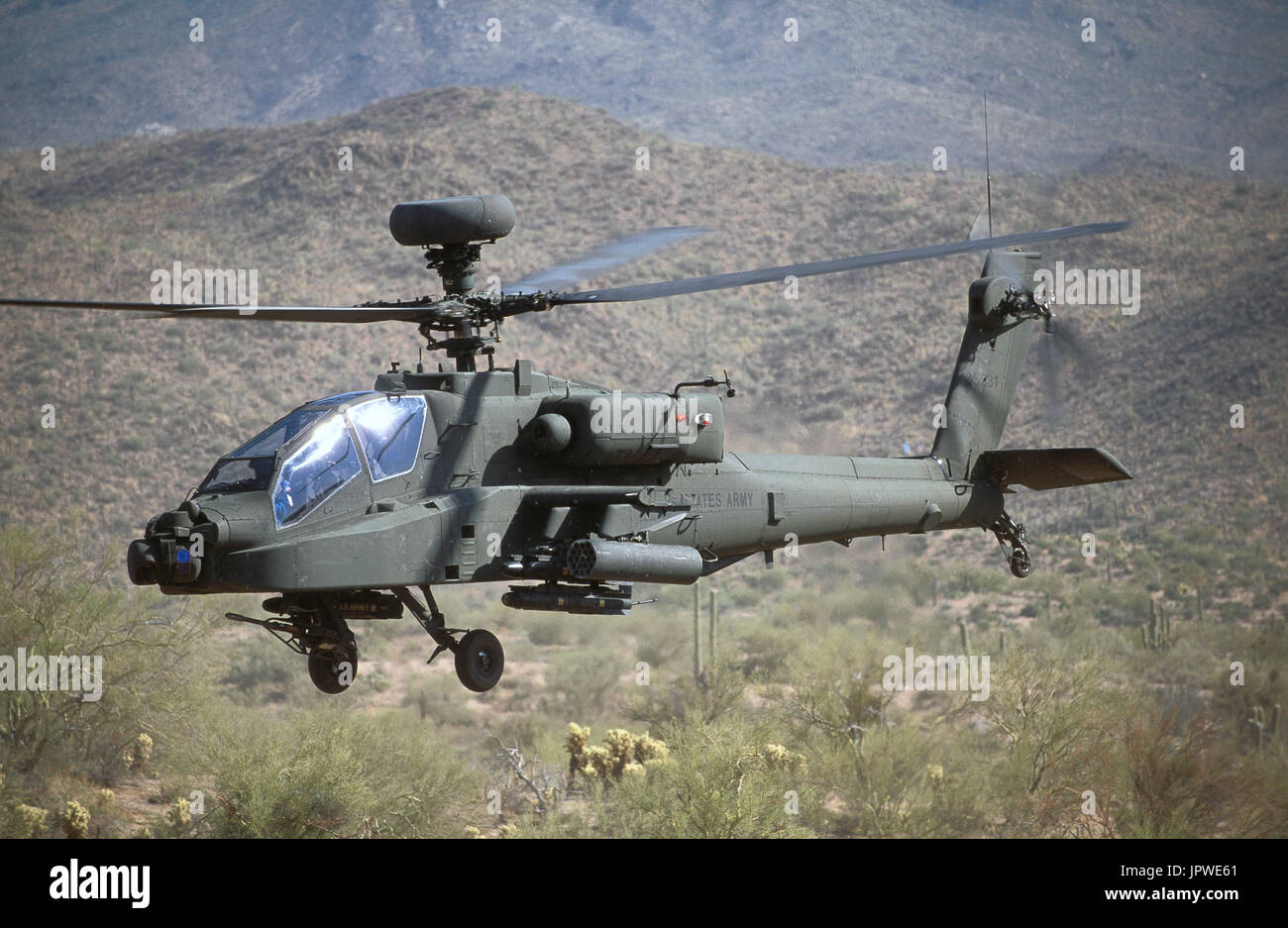 US Army Boeing AH-64D Apache Longbow low-flying over the Four Peaks ...