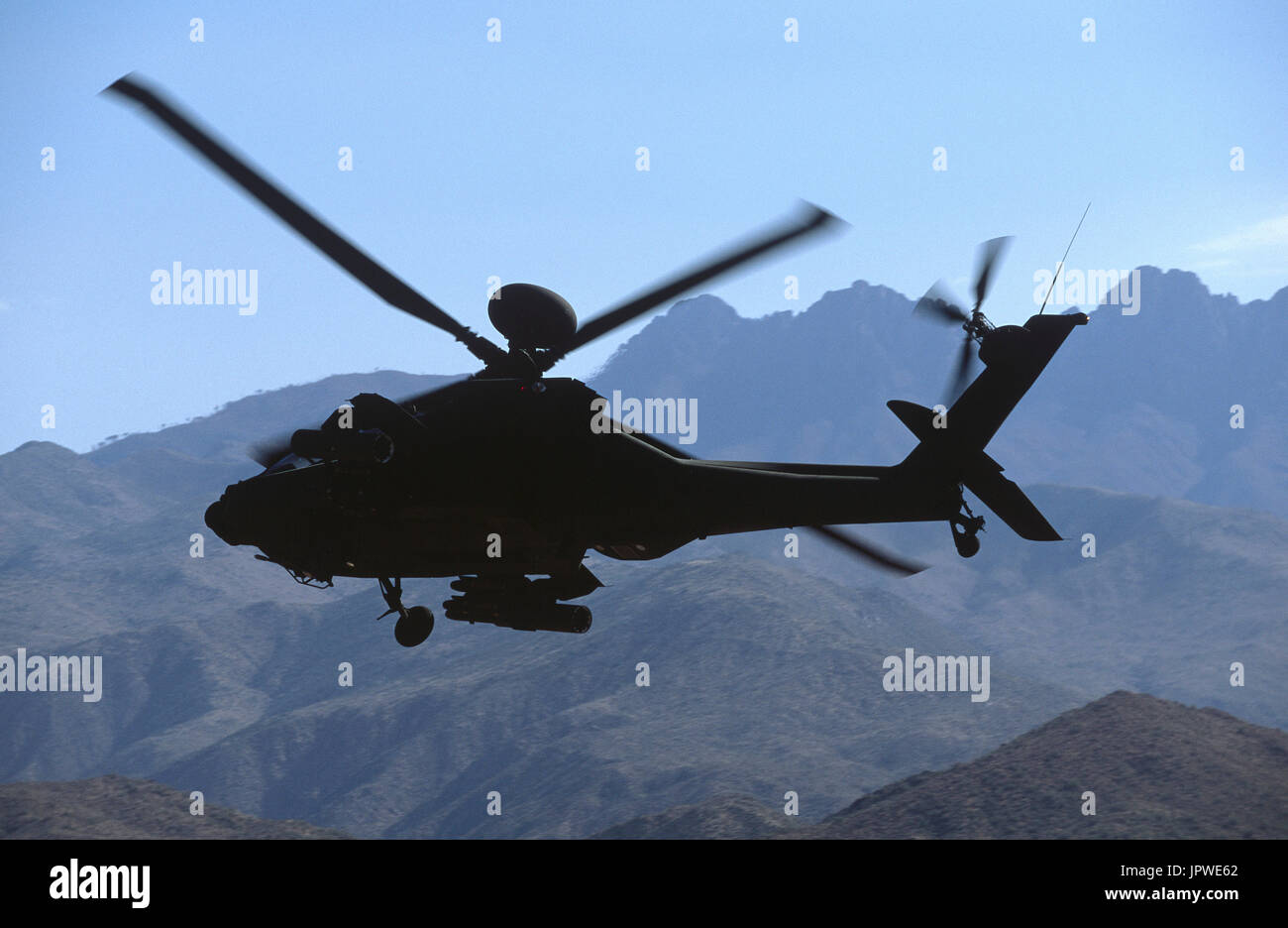 US Army Boeing AH-64D Apache Longbow low-flying over the Four Peaks ...