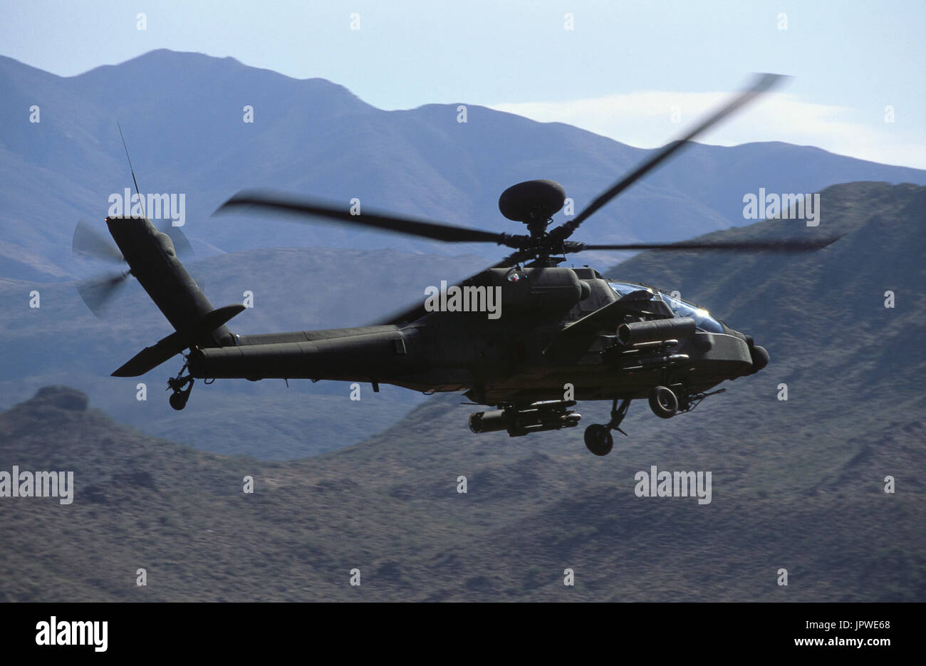 US Army Boeing AH-64D Apache Longbow low-flying over the Four Peaks ...