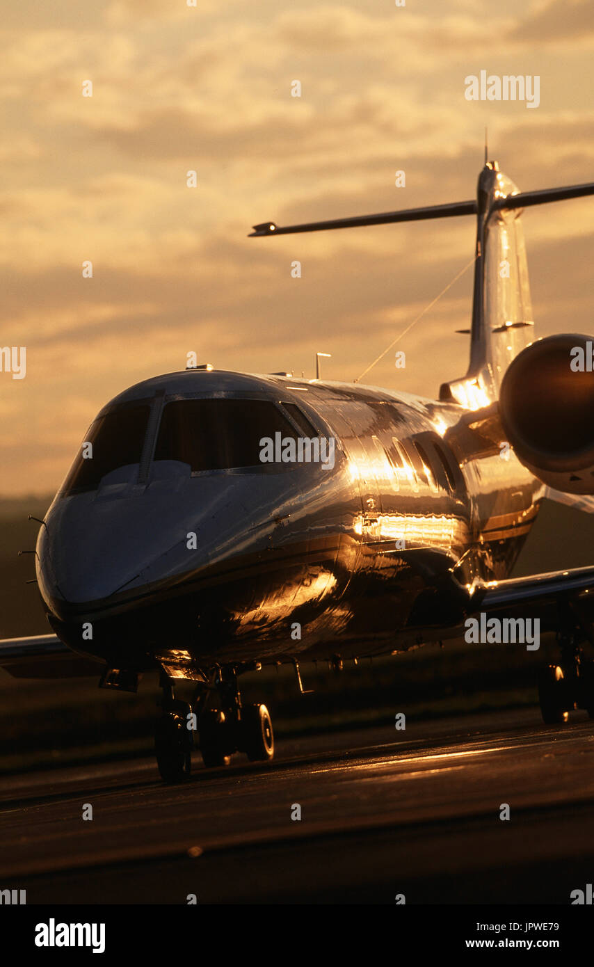 Bombardier Learjet parked with sun glinting off of the fuselage Stock ...