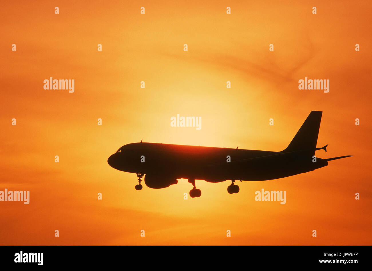 Airbus A320 on final-approach at sunset with undercarriage down Stock ...