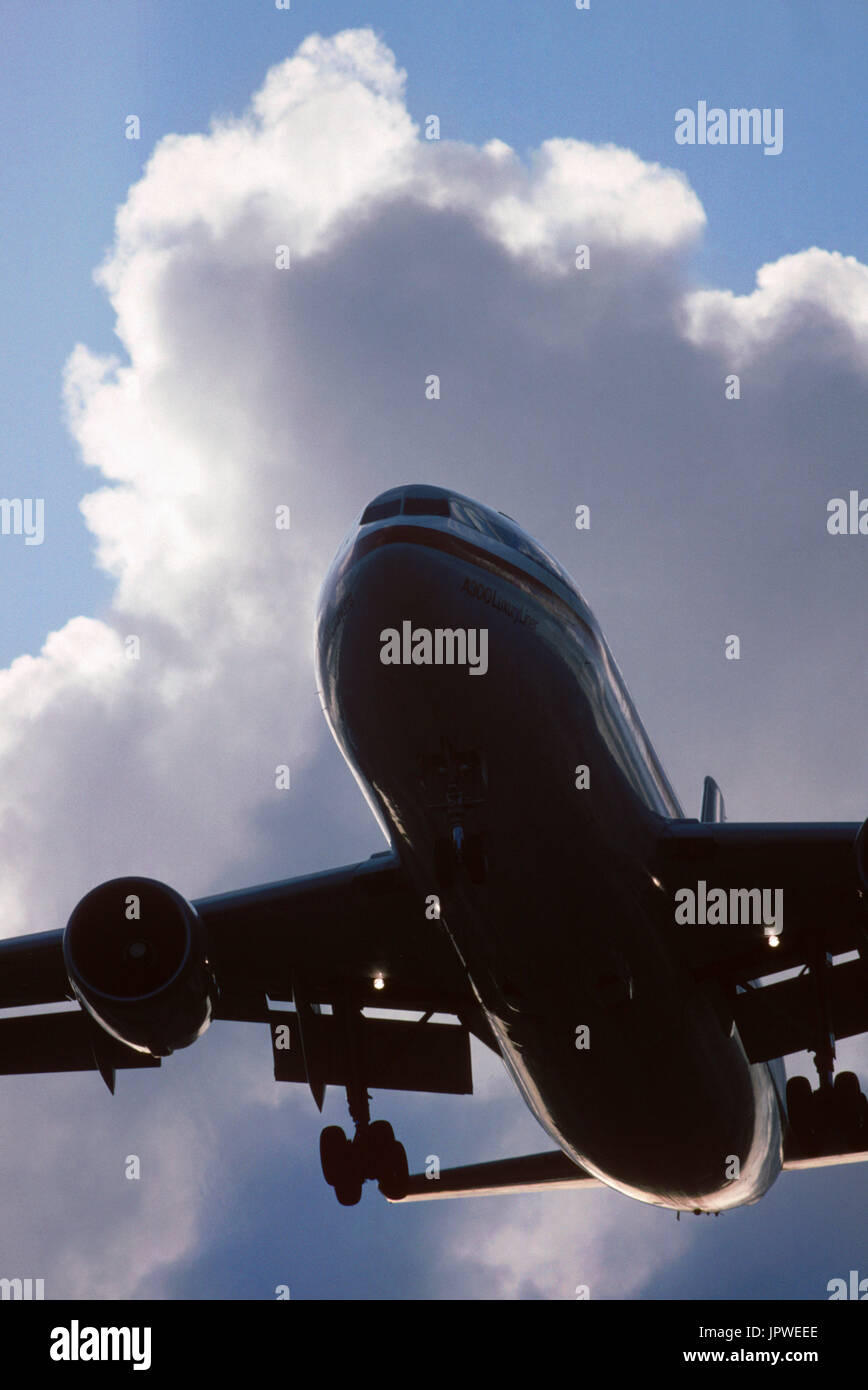 Airbus A300-600R on final-approach with clouds Stock Photo - Alamy
