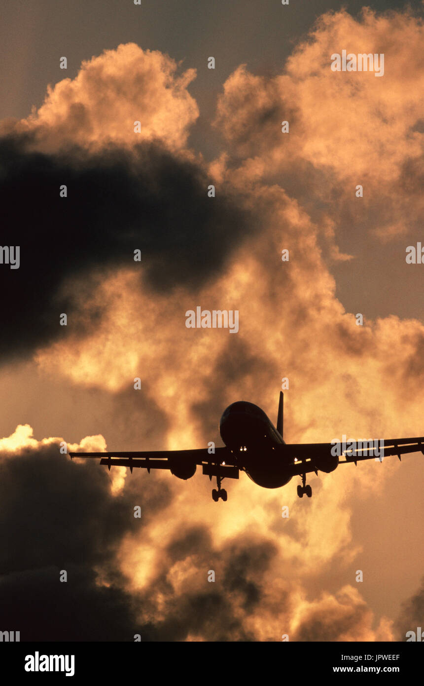 Airbus A300-600R on final-approach with clouds Stock Photo - Alamy