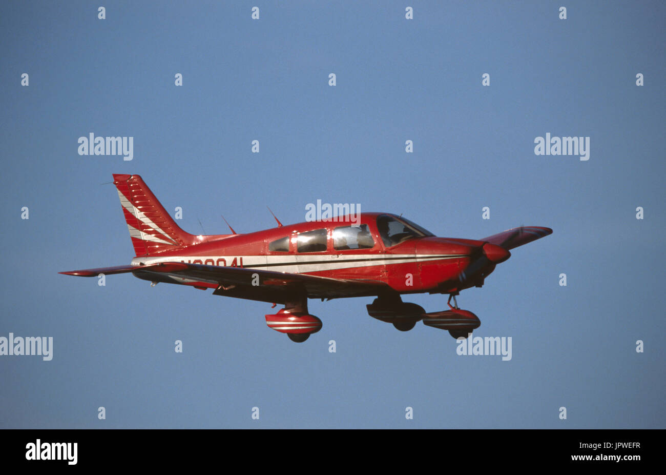 red Piper PA-28 Cherokee flying enroute Stock Photo - Alamy