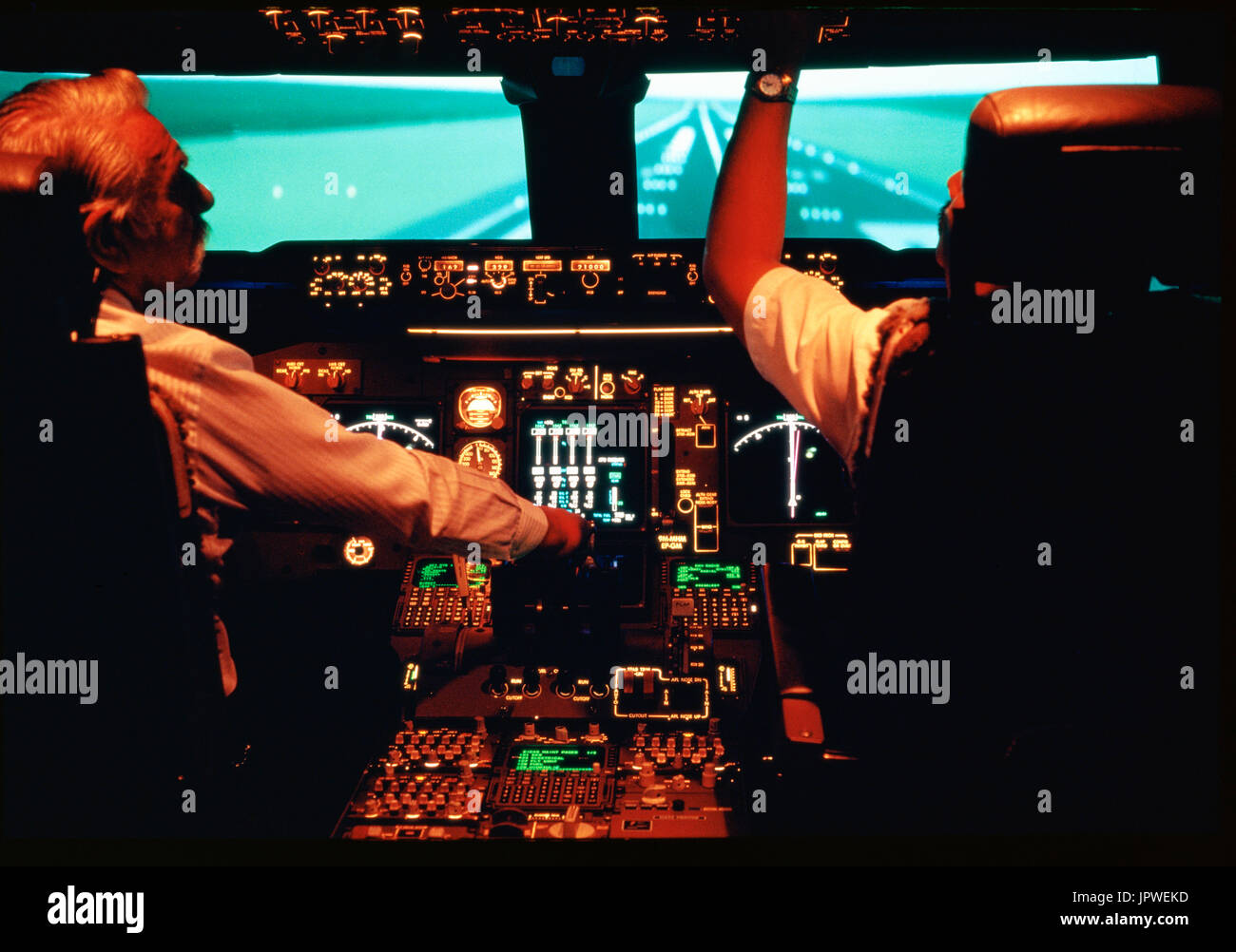 pilots in a Boeing 747-400 aircraft cockpit-simulator at the Thai ...