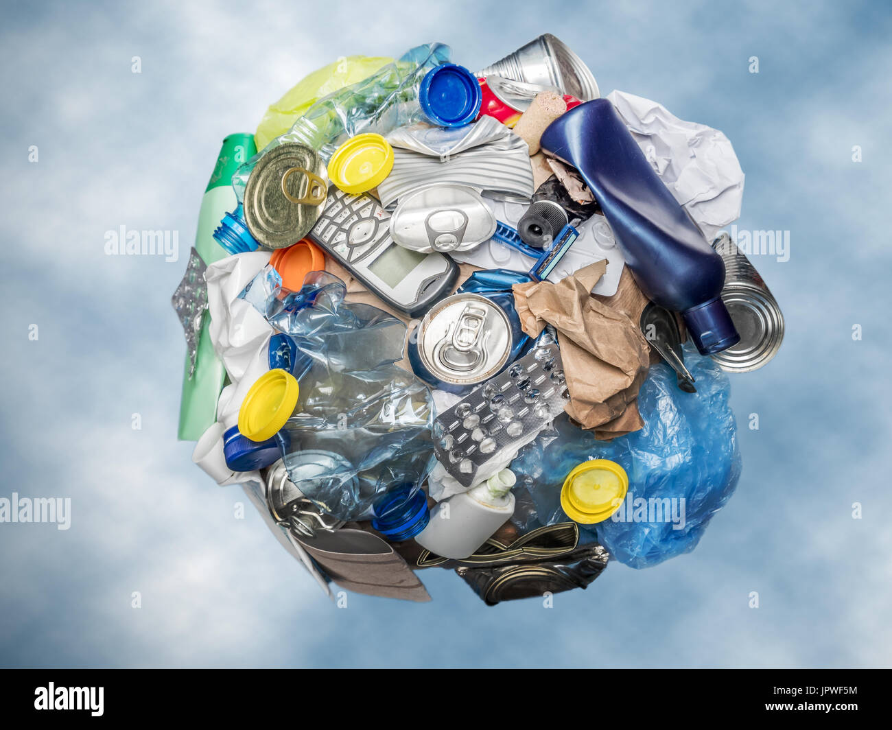 Sphere as Planet Earth formed from assorted domestic waste over blue ...