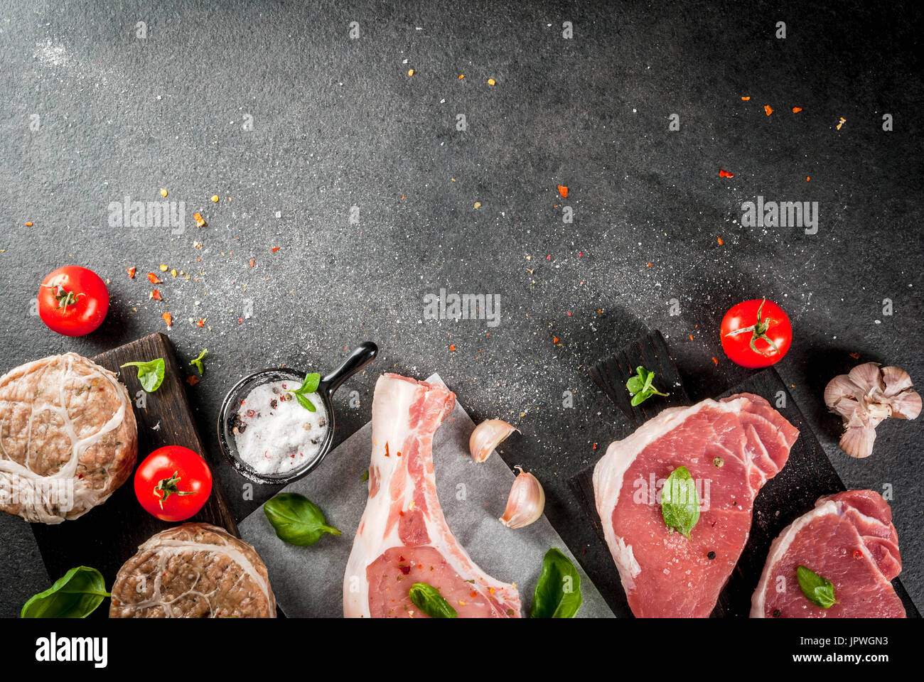 Raw organic meat. Selection of several types of red meat: pork cutlet ...