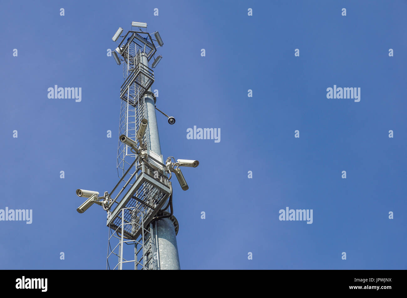 security camera on pole high tower of CCTV system in daytime Stock ...