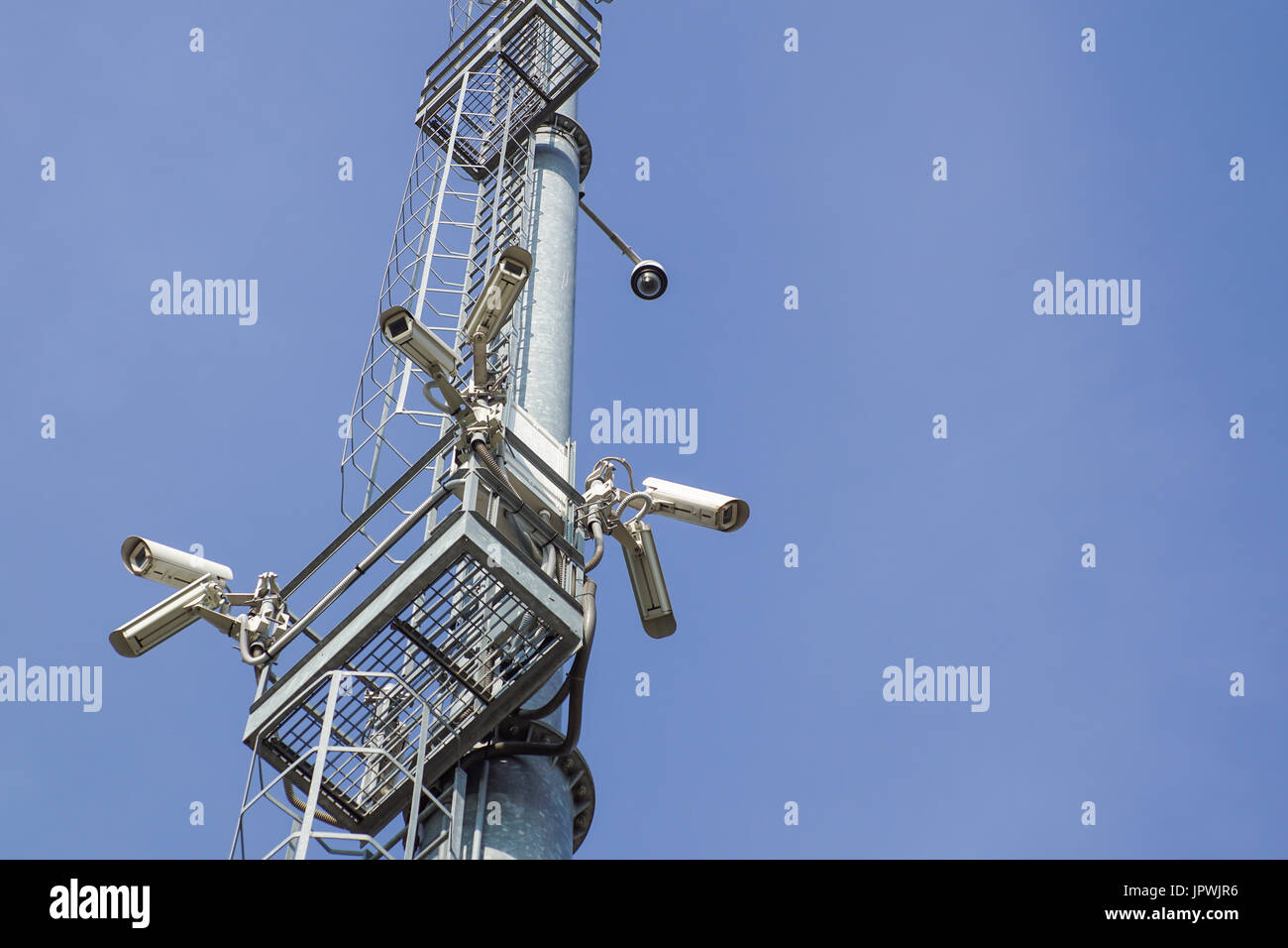 security camera on pole high tower of CCTV system in daytime Stock ...