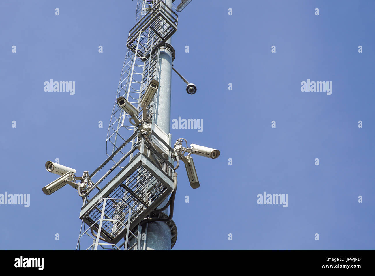 security camera on pole high tower of CCTV system in daytime Stock ...