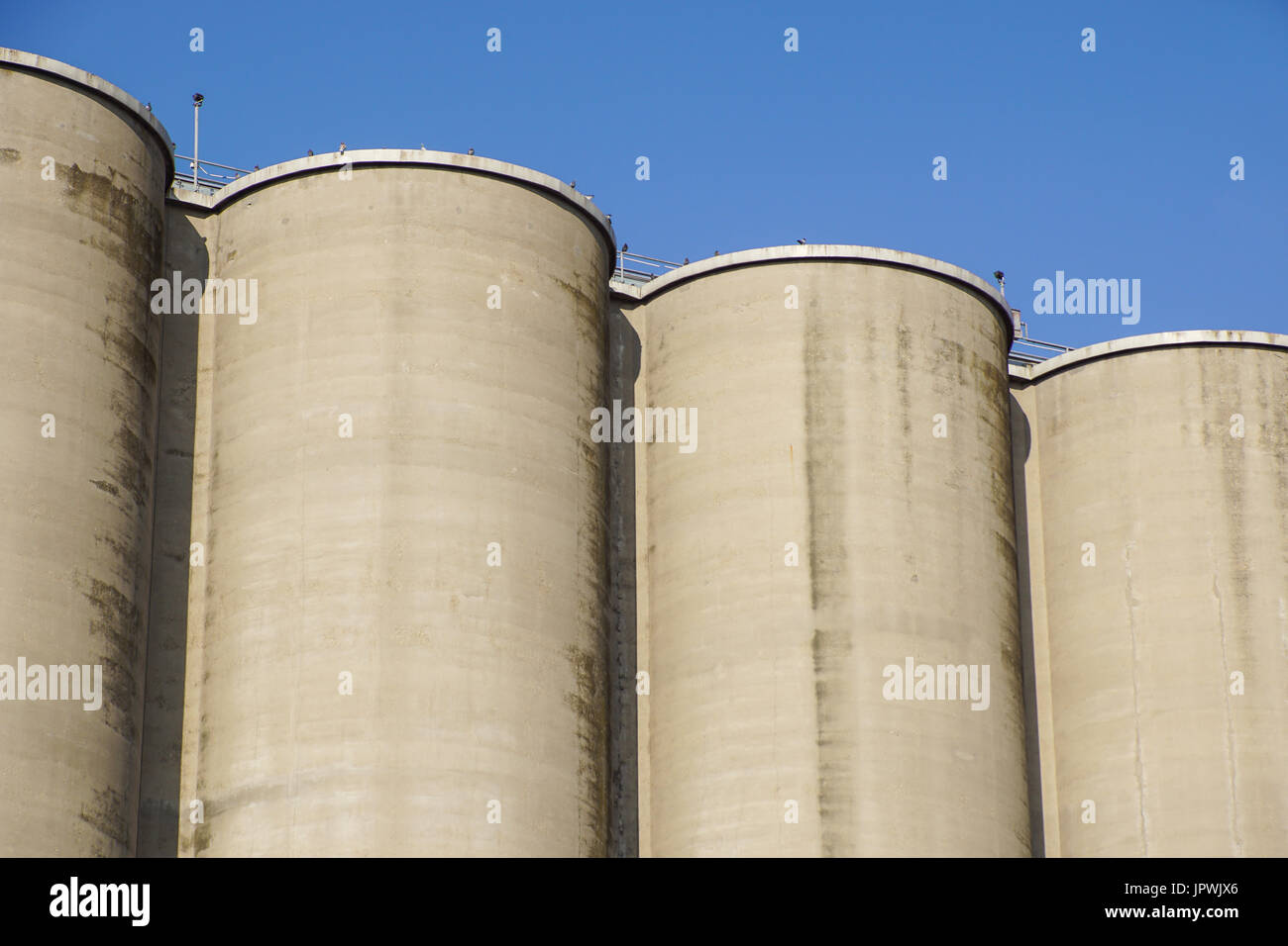 Exterior view of a cement factory, Silos for storage Stock Photo - Alamy