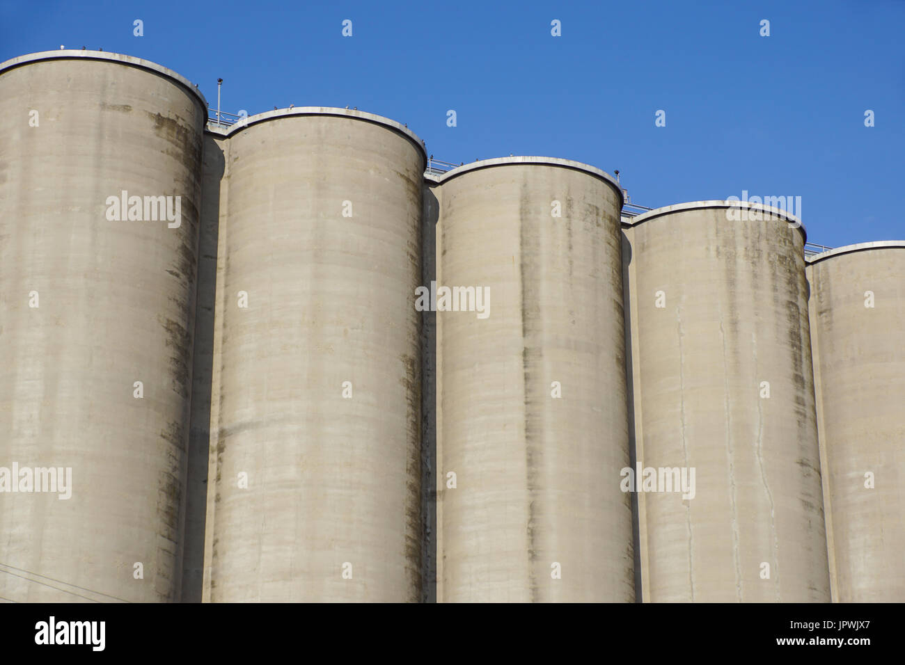 Exterior view of a cement factory, Silos for storage Stock Photo - Alamy