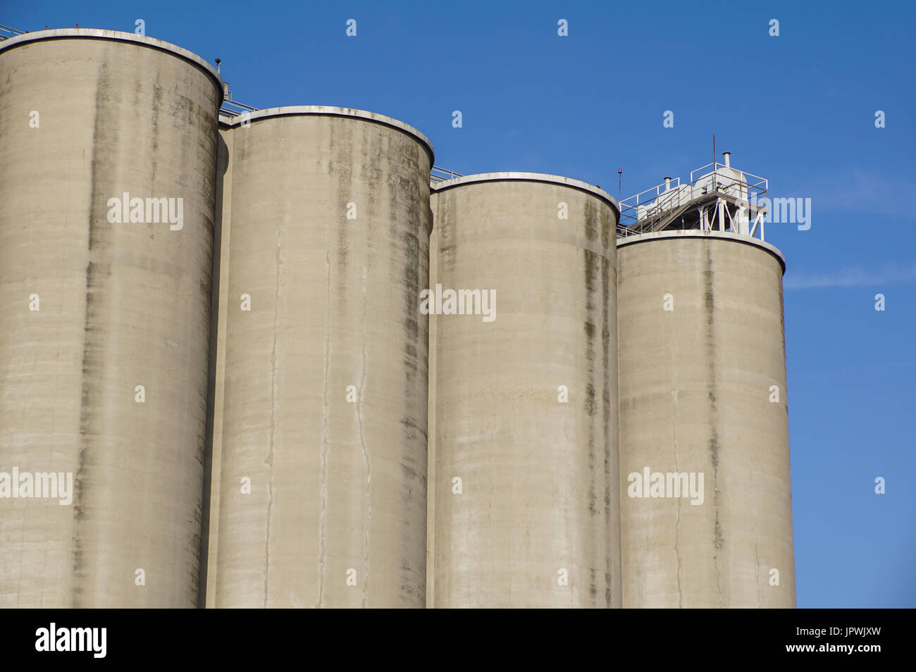 Exterior view of a cement factory, Silos for storage Stock Photo - Alamy