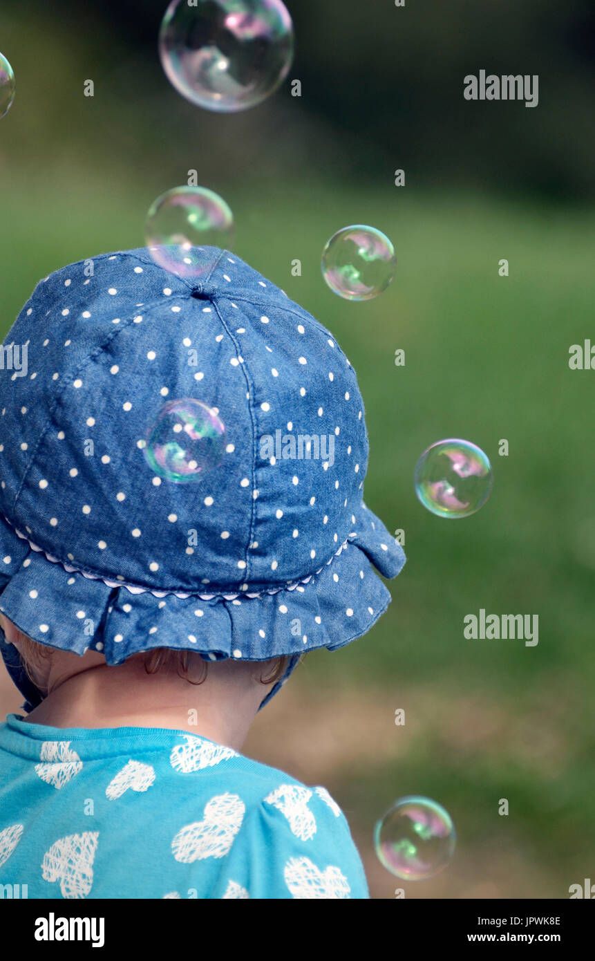 small child with bubbles from rear Stock Photo - Alamy