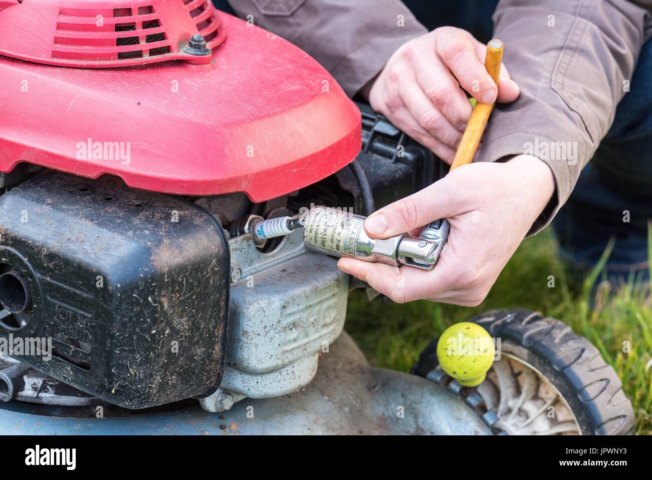 Maintenance of a lawn mower Stock Photo - Alamy
