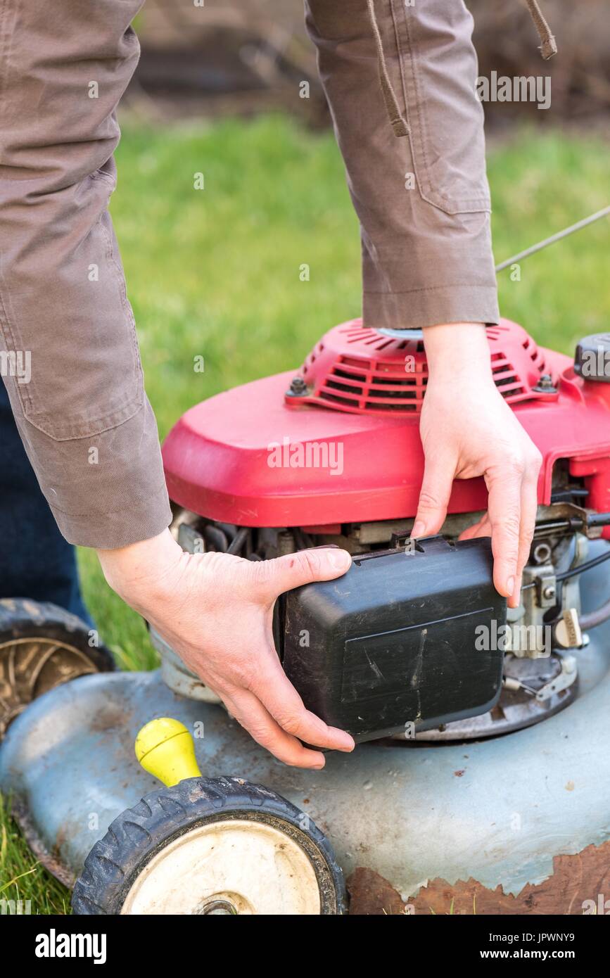 Maintenance of a lawn mower Stock Photo - Alamy