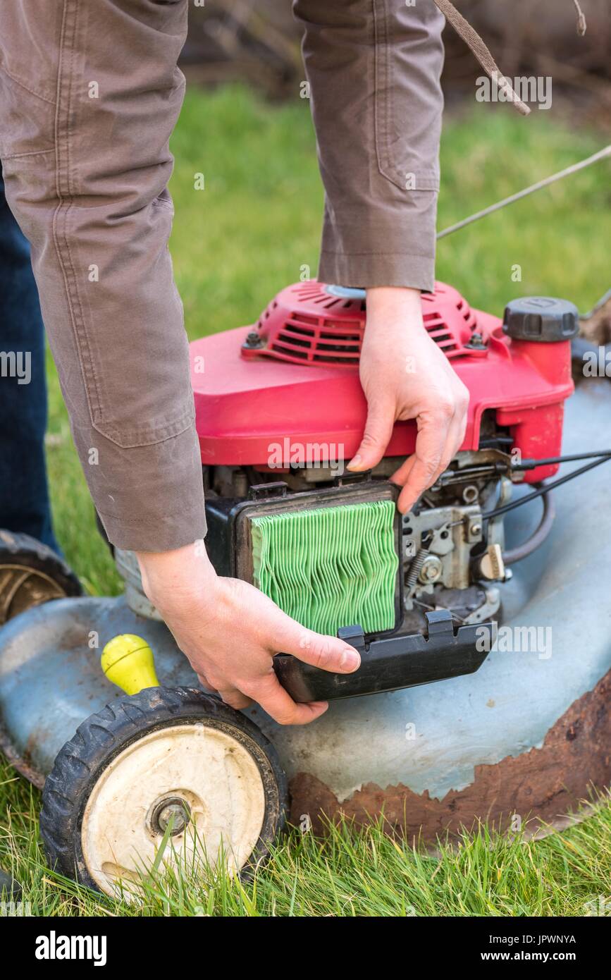 Maintenance of a lawn mower Stock Photo - Alamy