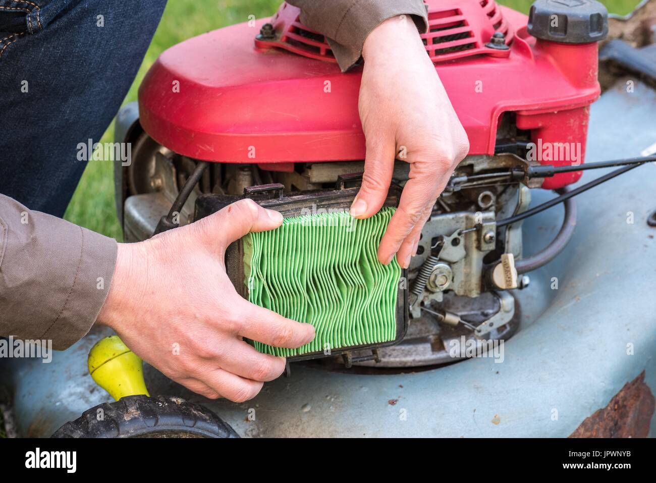 Maintenance of a lawn mower Stock Photo - Alamy