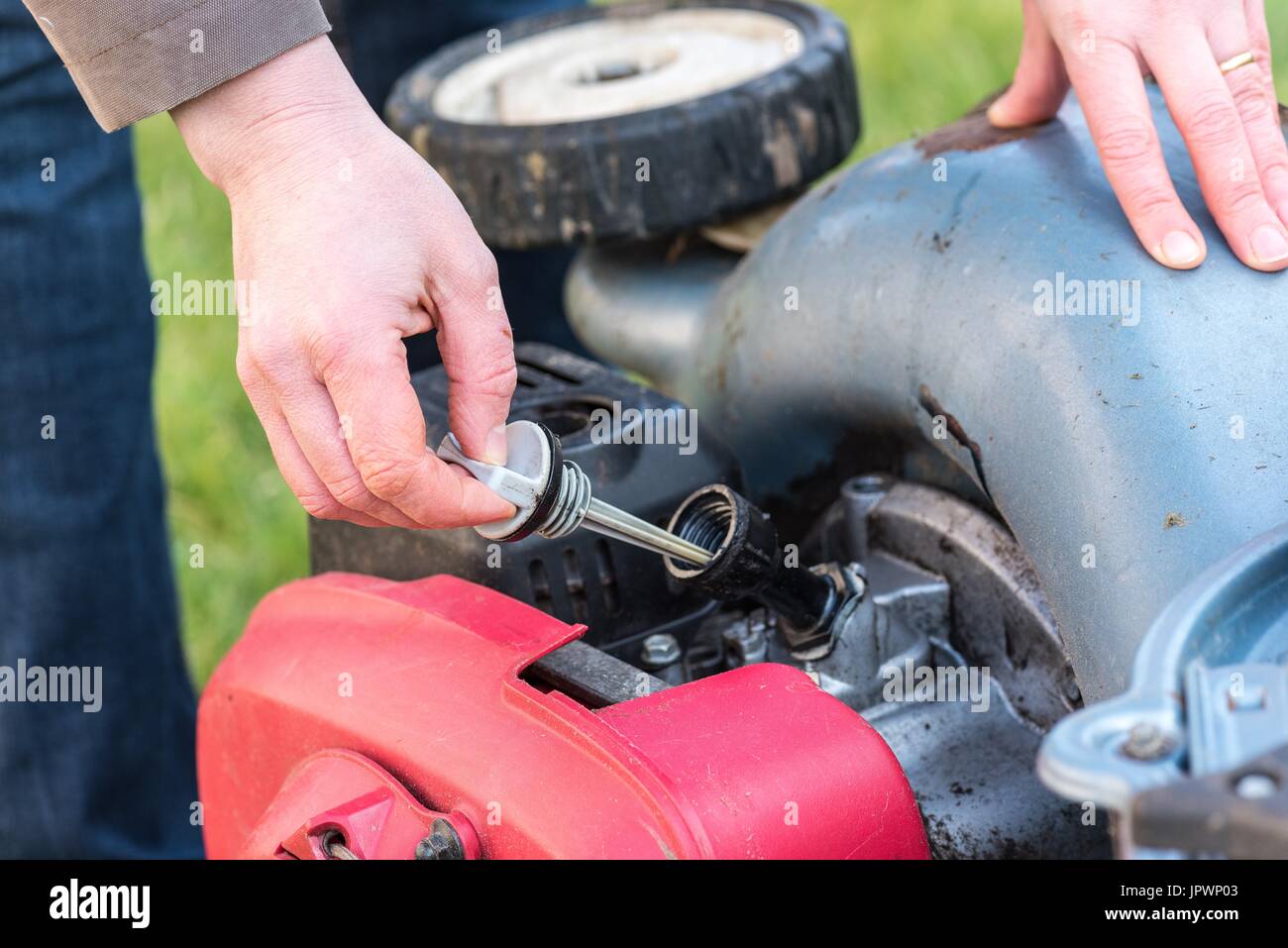 Maintenance of a lawn mower Stock Photo - Alamy
