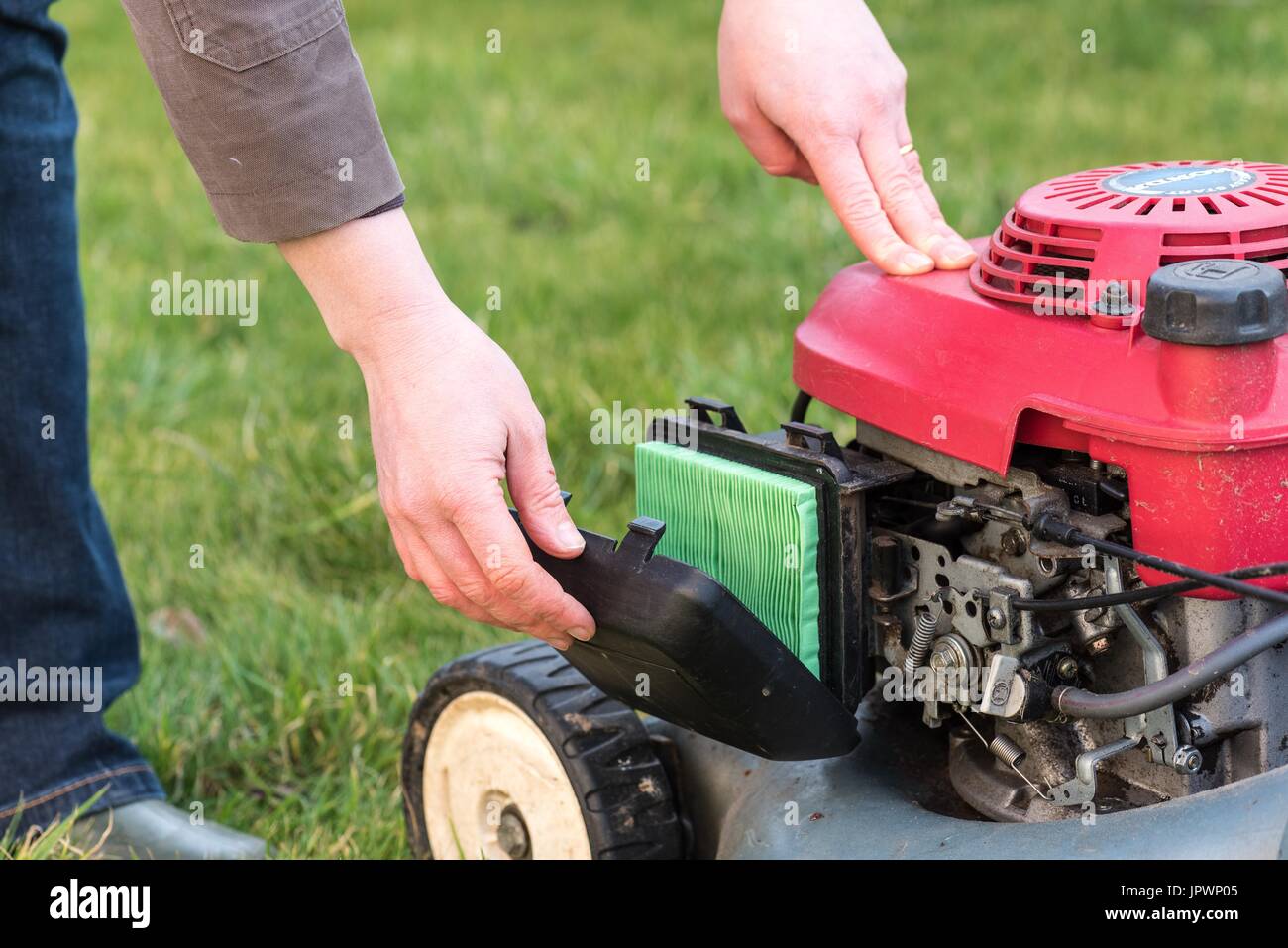 Maintenance of a lawn mower Stock Photo - Alamy