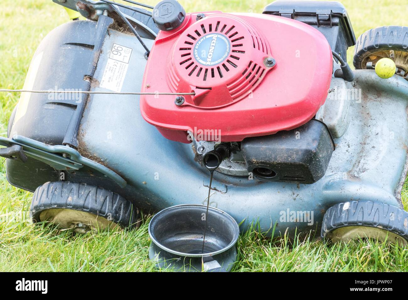 Maintenance of a lawn mower Stock Photo - Alamy
