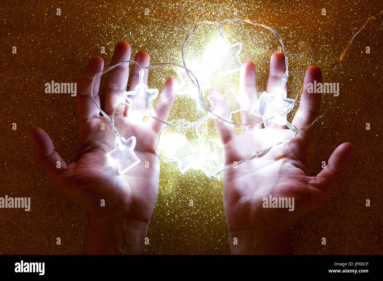 lights in the hands Stock Photo - Alamy