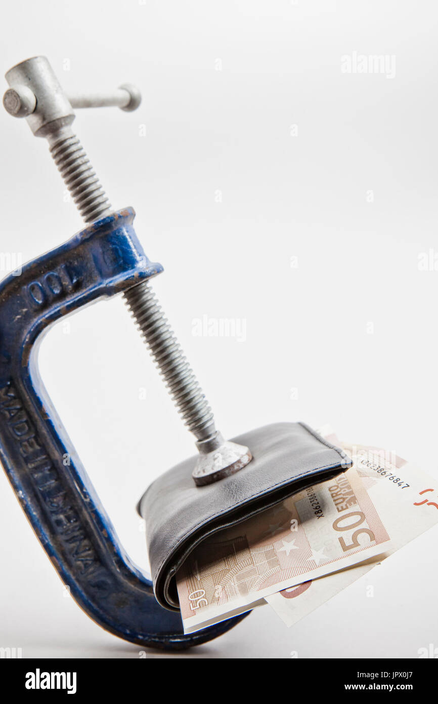 wallet squeezed in a clamp Stock Photo - Alamy