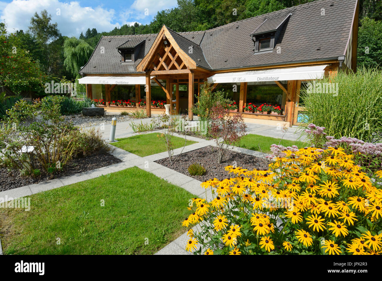 G. Miclo distillery shop and garden - Vosges France Stock Photo - Alamy