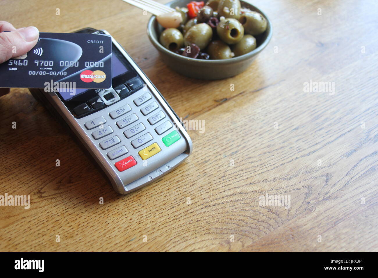 contactless payment card pdq background copy space with hand holding ...