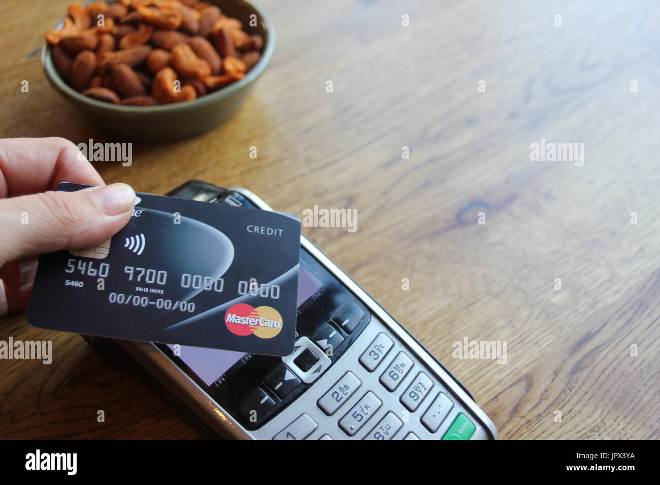 contactless payment card pdq background copy space with hand holding ...