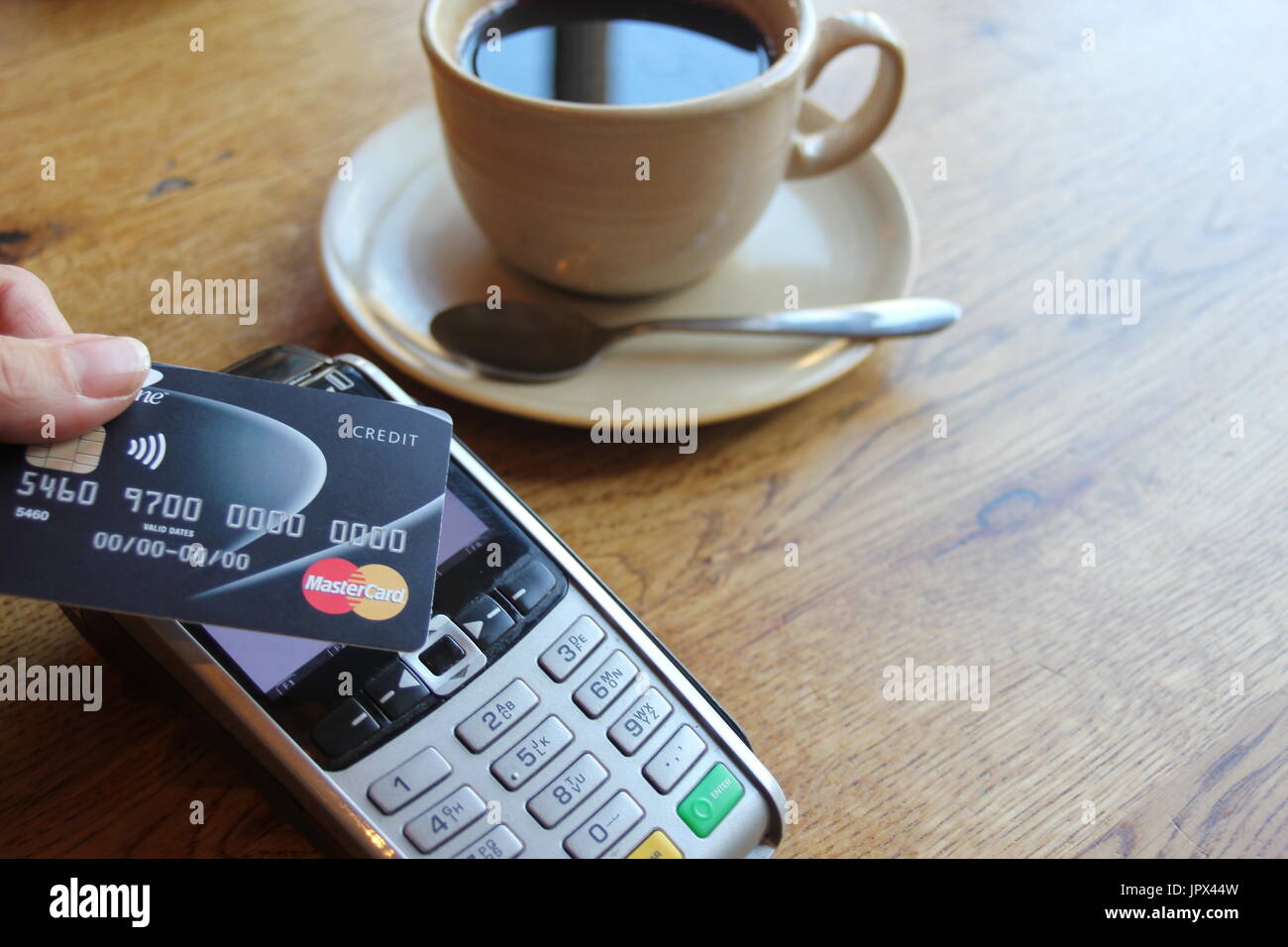 contactless payment card pdq background copy space with hand holding ...