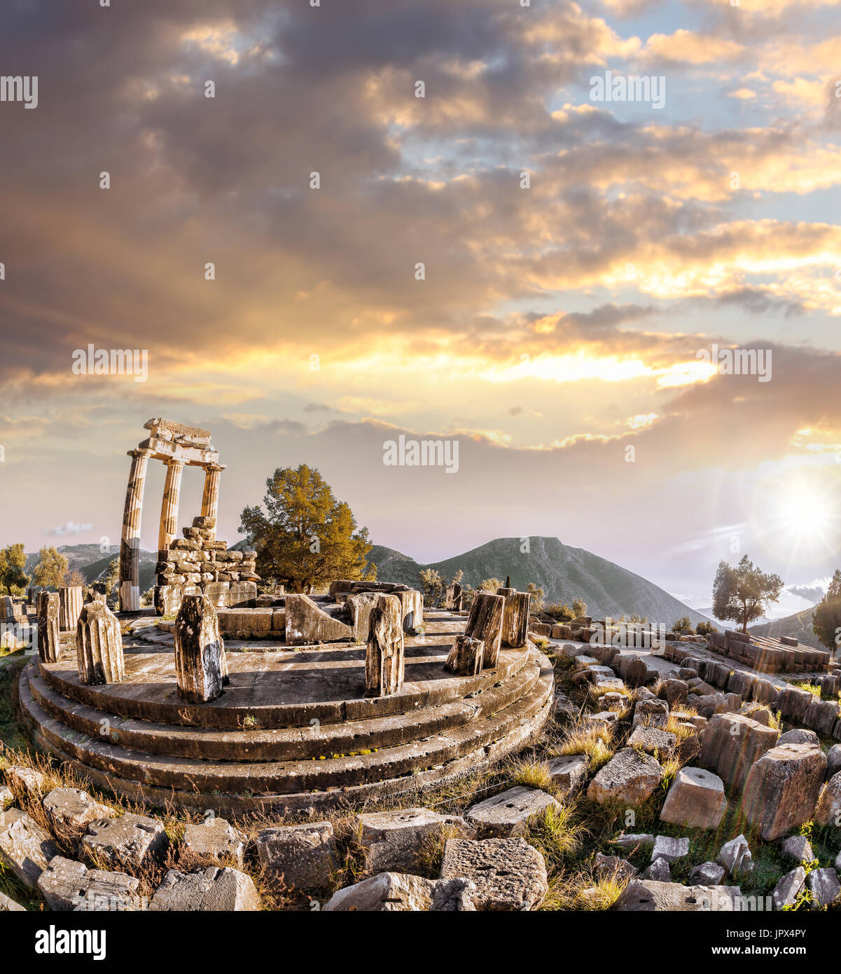 Delphi with ruins of the Temple against sunset in Greece Stock Photo ...