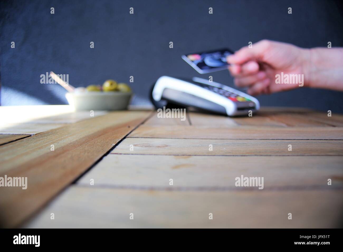 contactless payment card pdq background copy space with hand holding ...