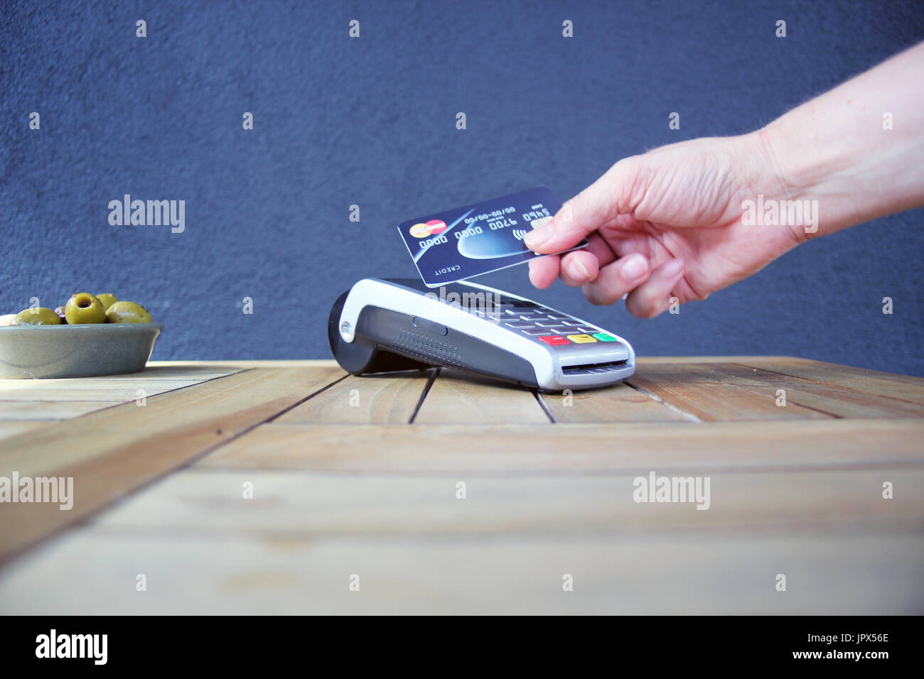 contactless payment card pdq background copy space with hand holding ...