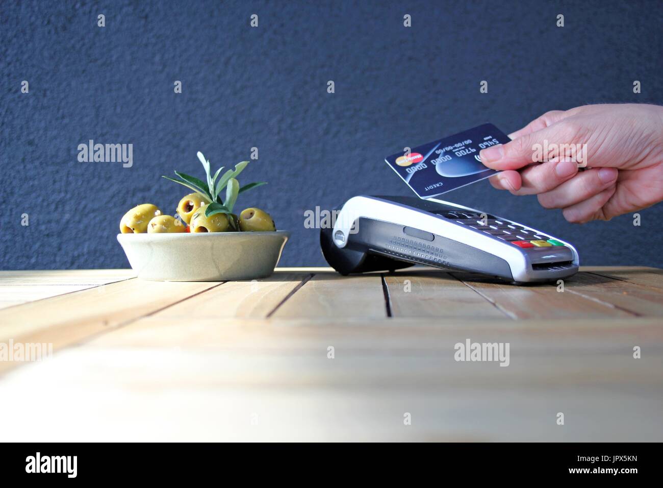 contactless payment card pdq background copy space with hand holding ...